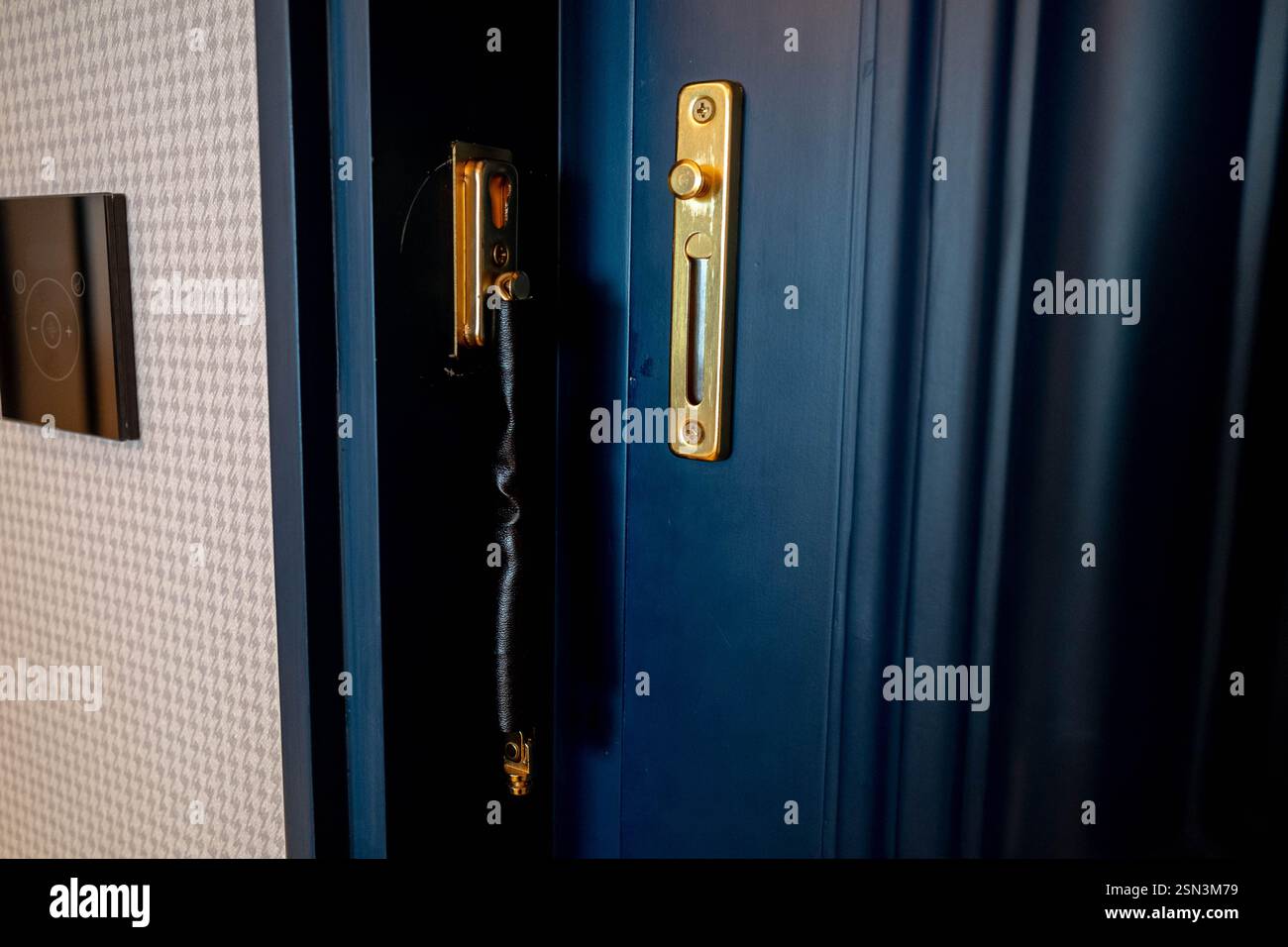 Close up of a gold color security door chain inside a hotel room Stock ...
