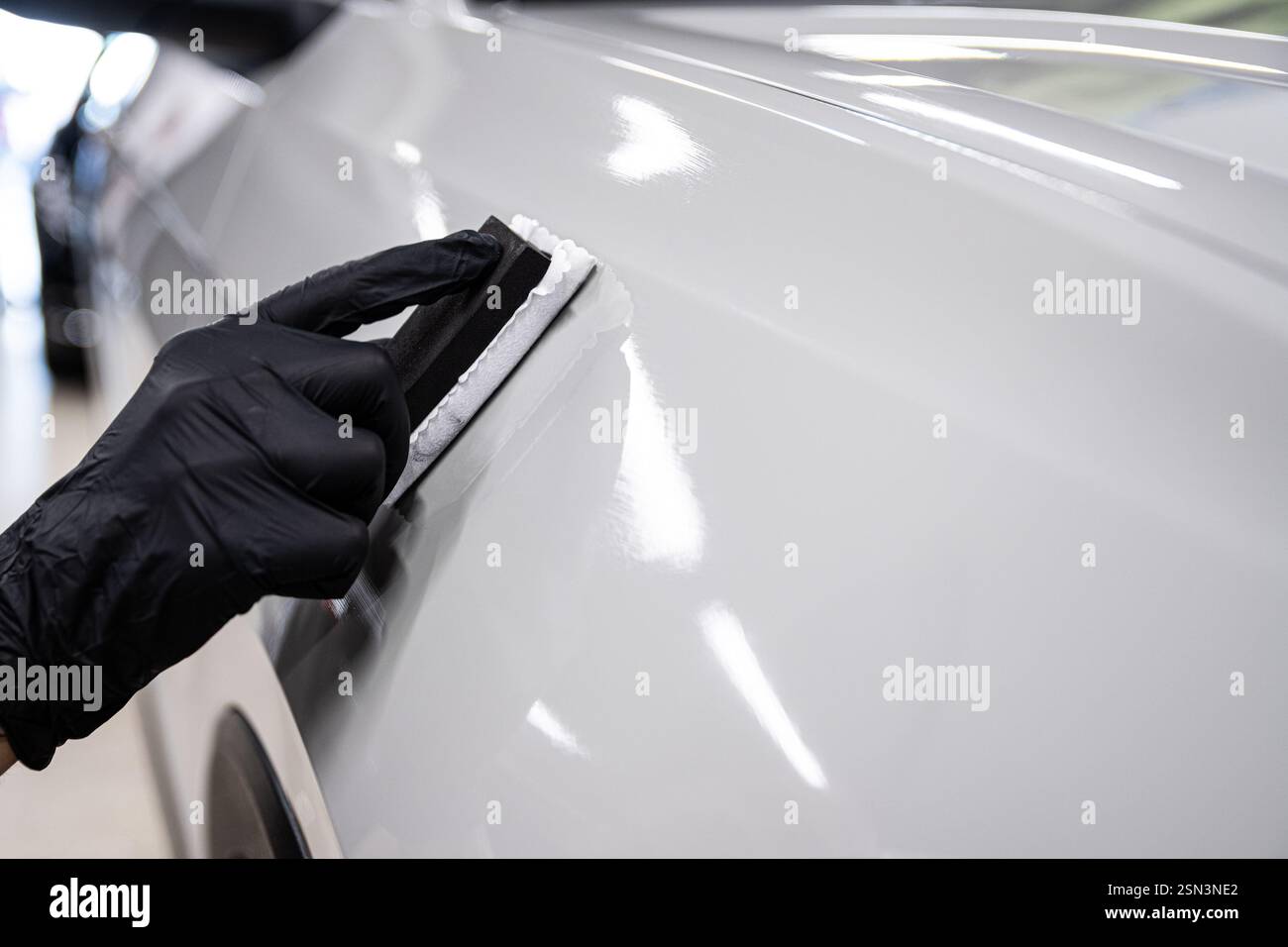 Ceramic or graphene coating on white paint Stock Photo - Alamy