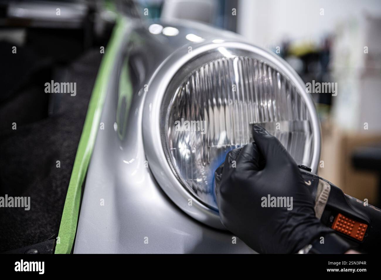Headlight polishing removes fog and scratches Stock Photo - Alamy