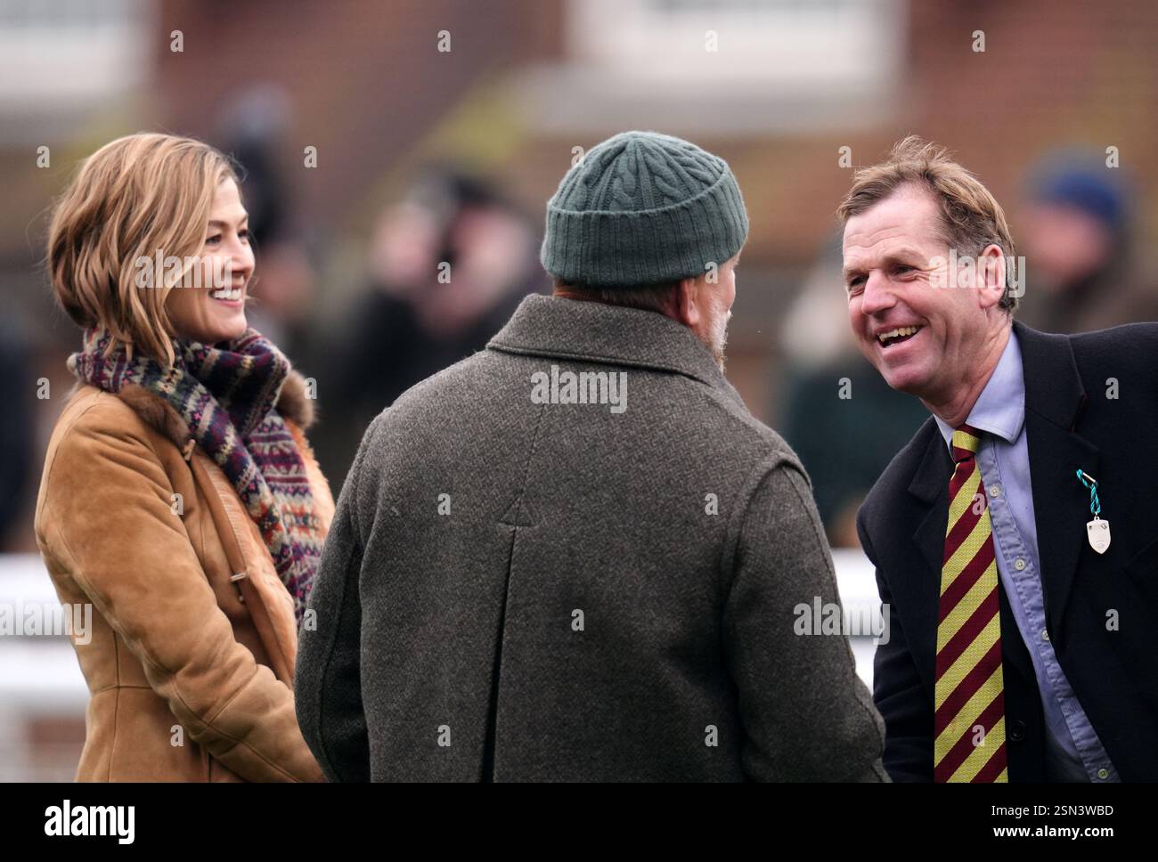 Rosamund Pike (left) and Guy Ritchie speaking with trainer Jamie ...