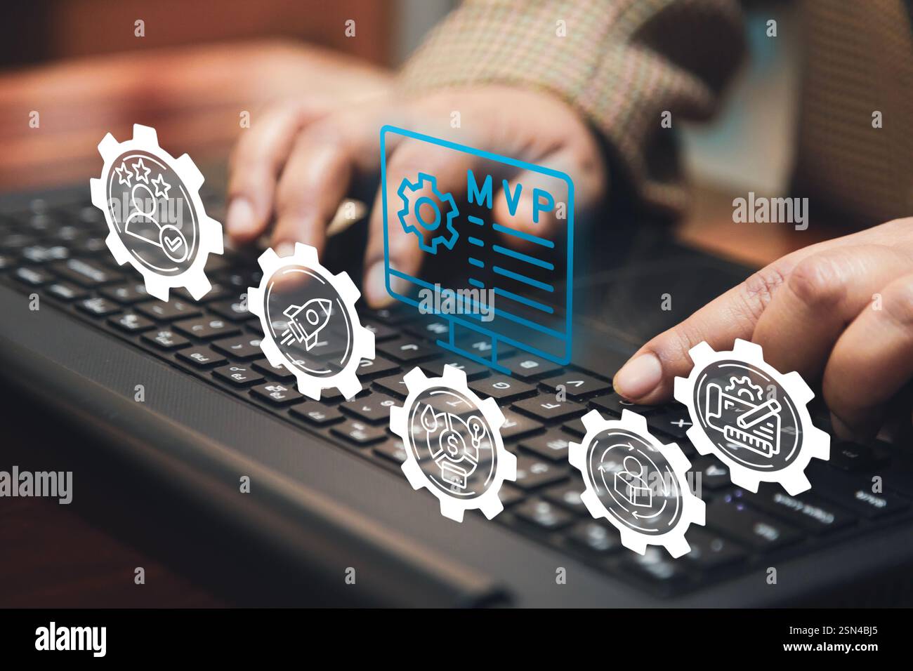 A business person types on a keyboard with a digital overlay of "MVP ...