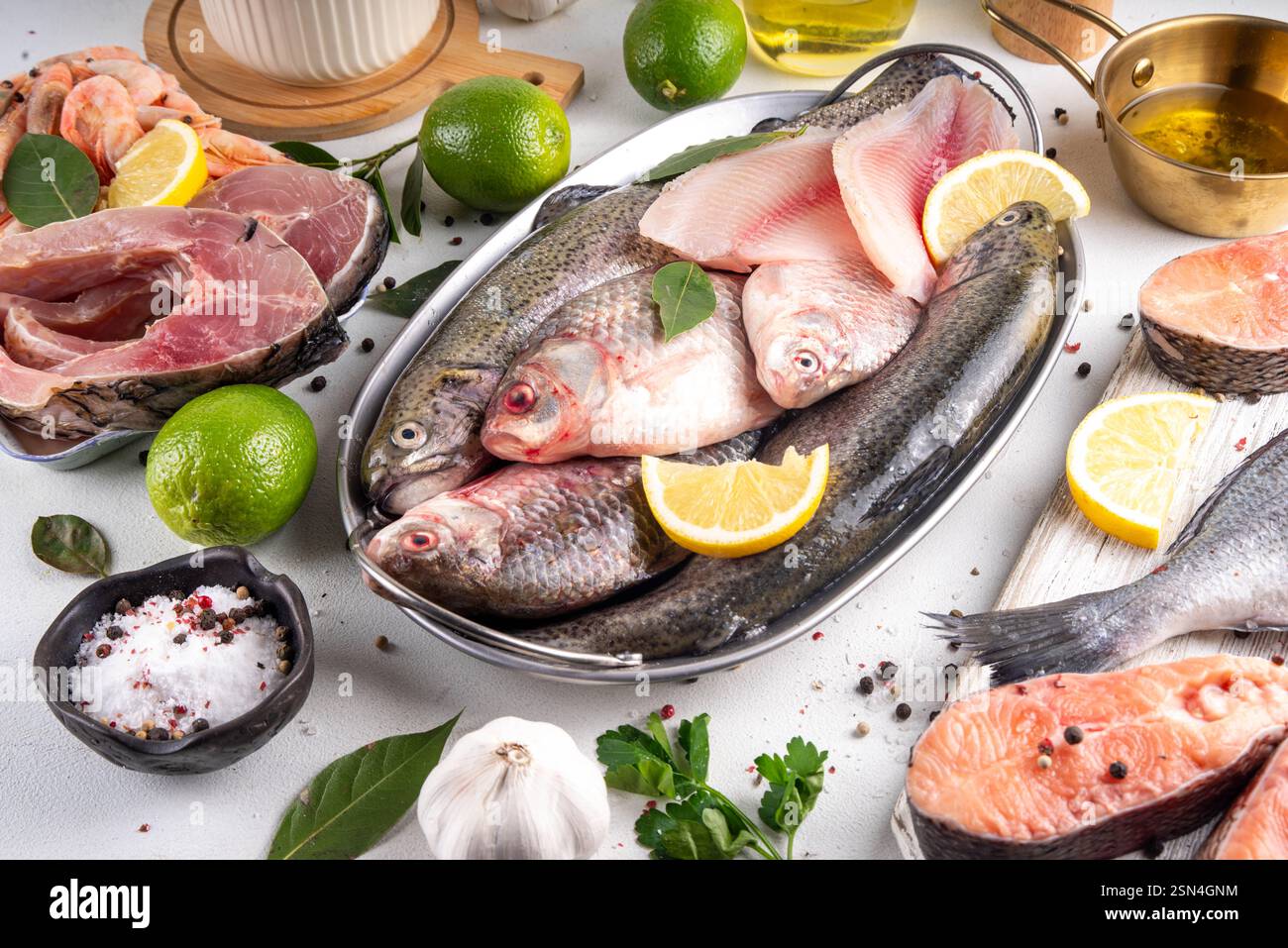 Variety raw fish and seafood background. Fresh fish, shrimps, mussels ...