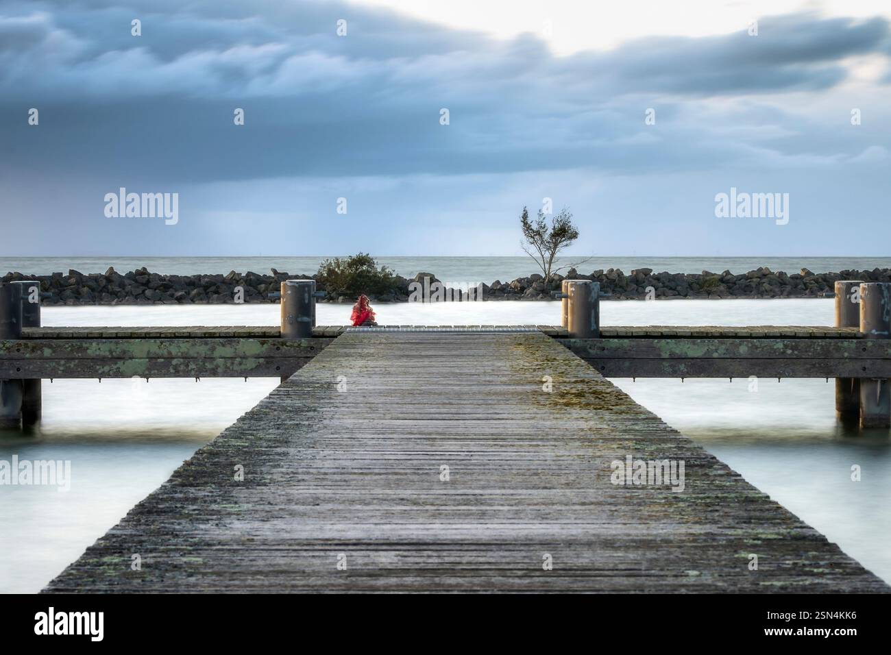 Seascape with coastal view over the Markermeer. Stone blocks storm ...