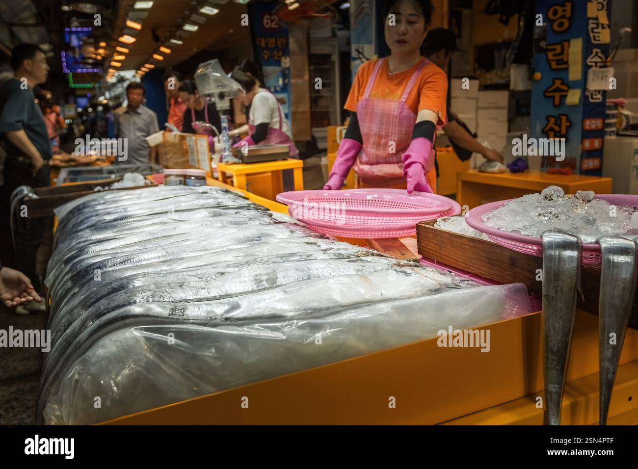 Korean woman selling fresh fish on the market in Jeju island South ...
