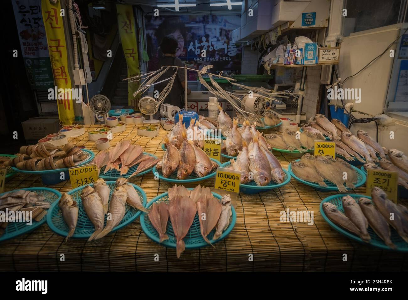 Korean woman selling fresh fish on the market in Jeju island South ...