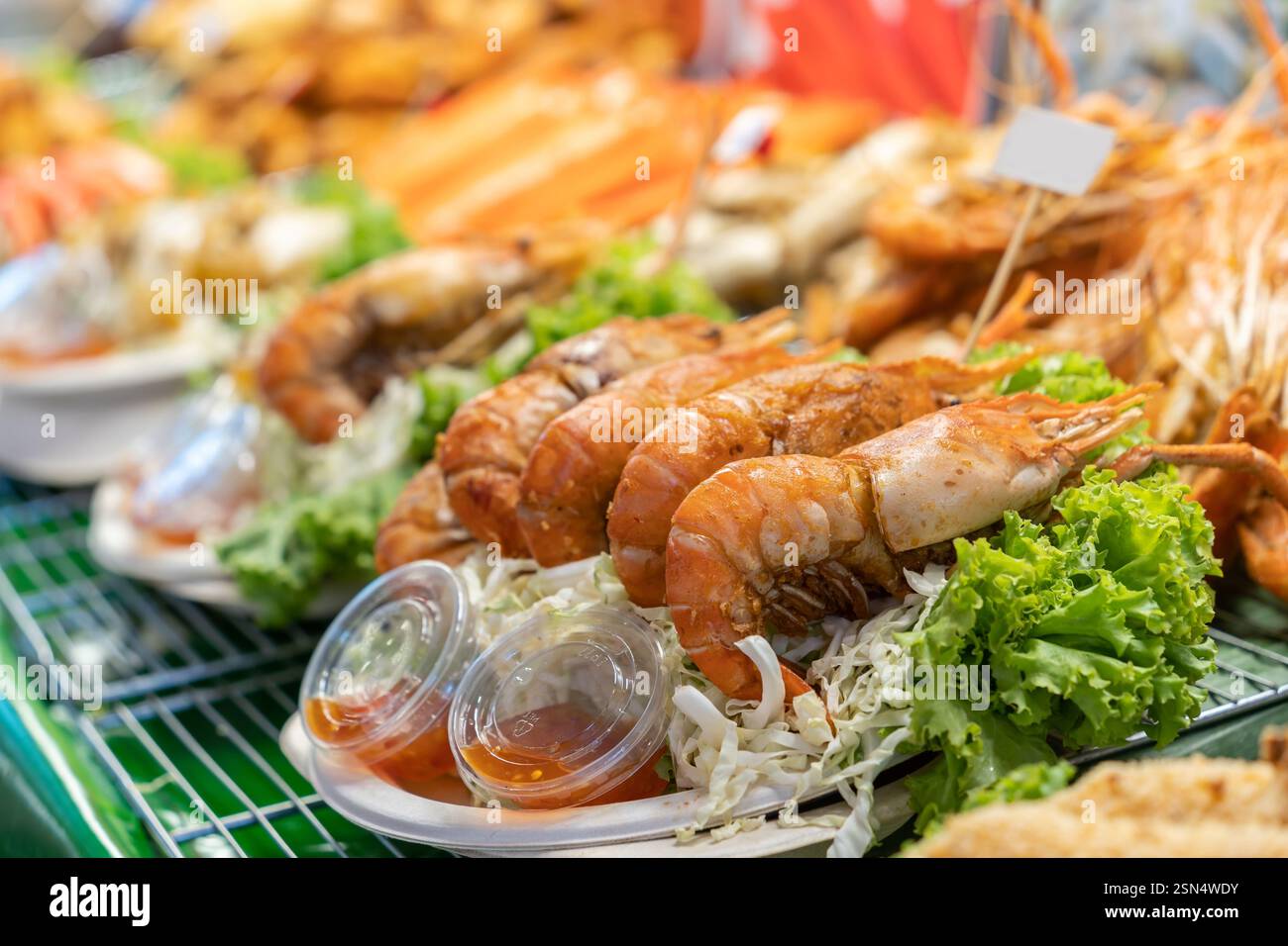 Grilled giant prawns with chili sauce is a popular and flavorful dish ...