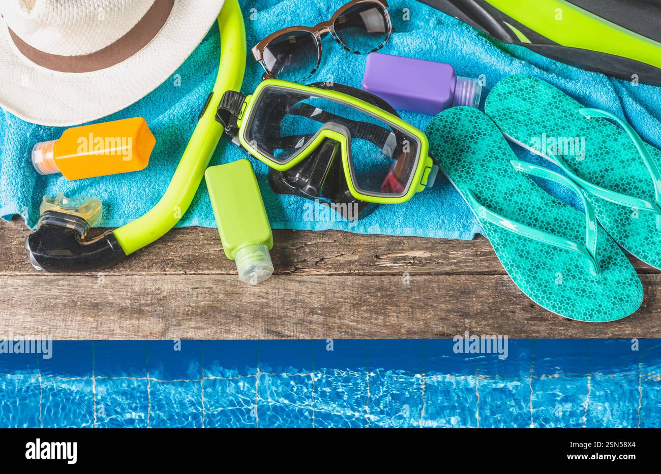 Dive into summer fun with snorkeling gear and beach essentials laid out ...