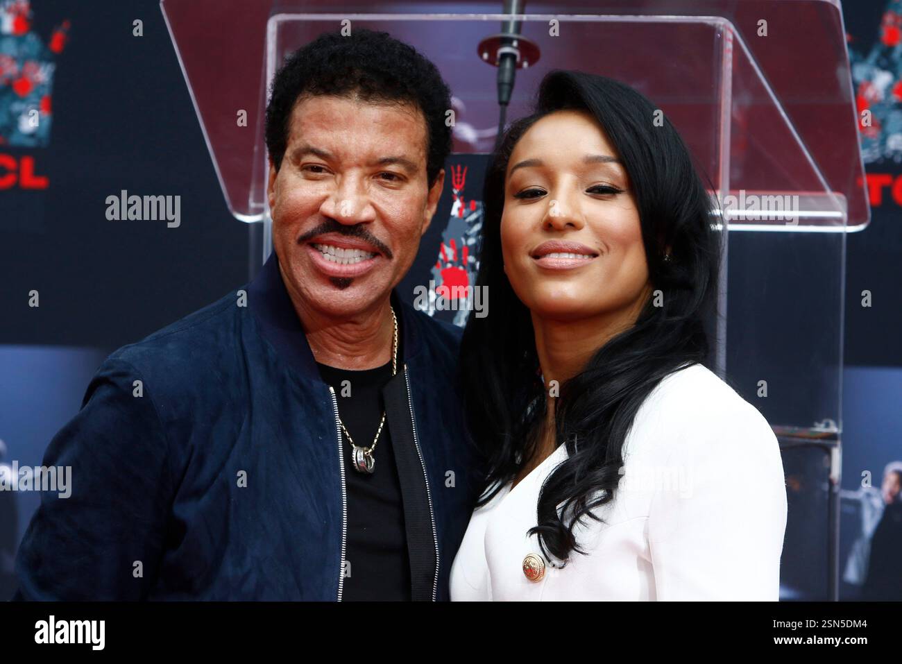 Lionel Richie and girlfriend Lisa Parisi attend Lionel Richie's hand ...