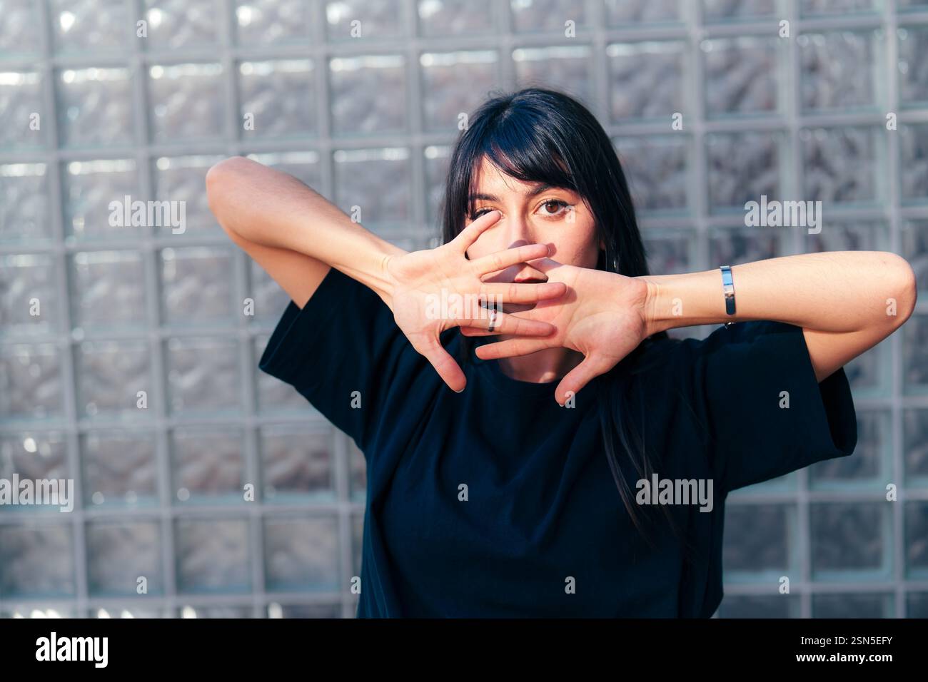 Woman performing expressive dance moves in a contemporary setting with ...
