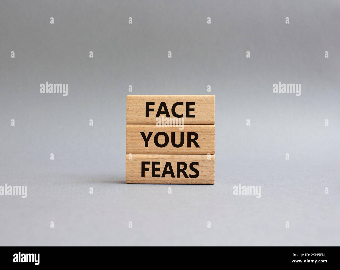 Face your Fears symbol. Wooden blocks with words Face your Fears ...