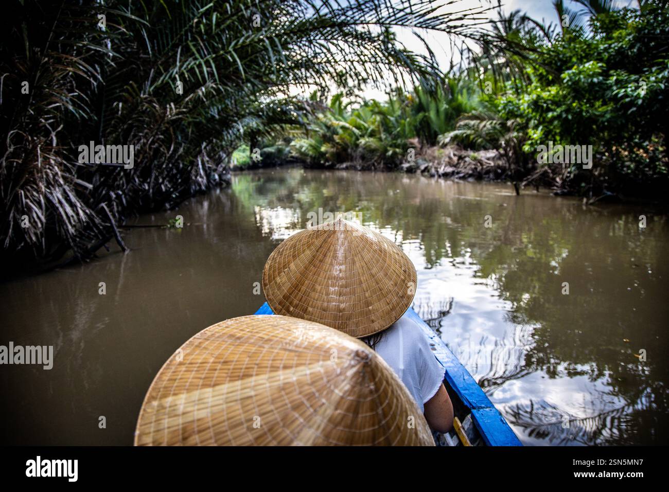 Ham Luong - Vietnam august 18 2024 - Boat traveling down a side arm of ...