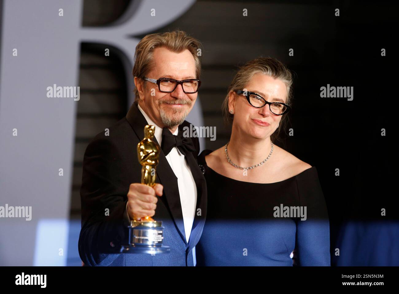 Gary Oldman and wife Gisele Schmidt attend the Vanity Fair Oscar Party ...