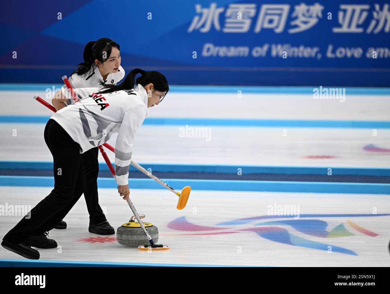 Harbin. 13th Feb, 2025. Kim Suji (L) and Kim Minji of South Korea ...