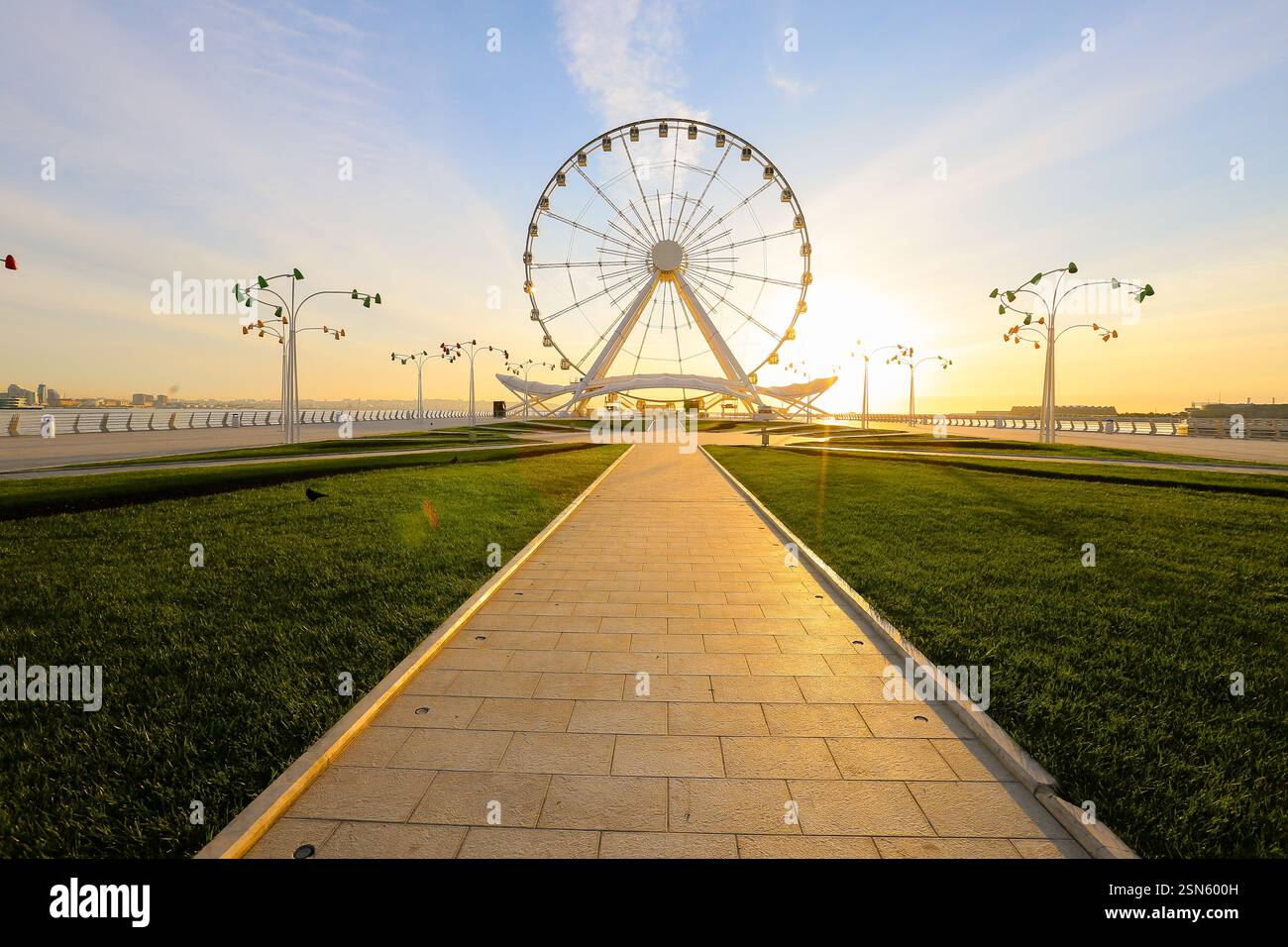 Ferris wheel on Baku Boulevard during sun rise Stock Photo - Alamy