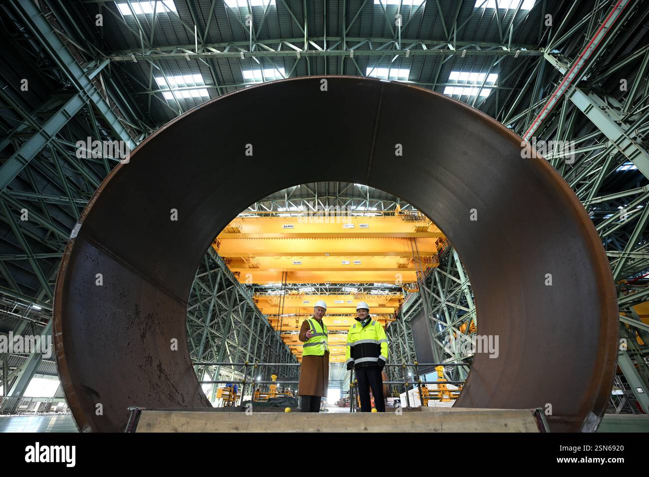King Charles III and SeAH President Joosung Lee stand in the section of ...