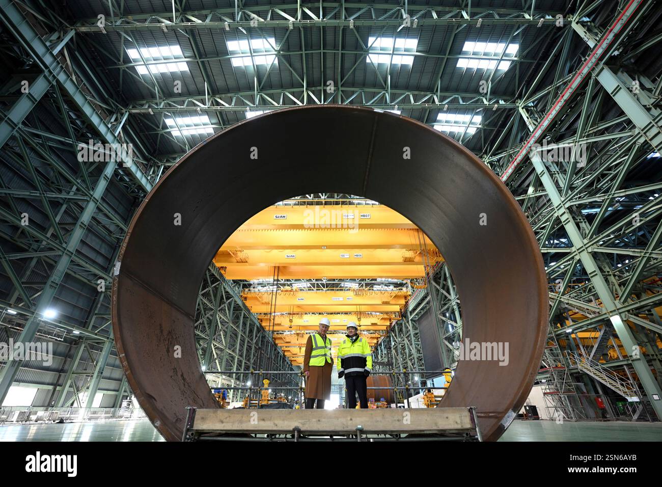 Britain's King Charles III, left, and SeAH President Joosung Lee stand ...