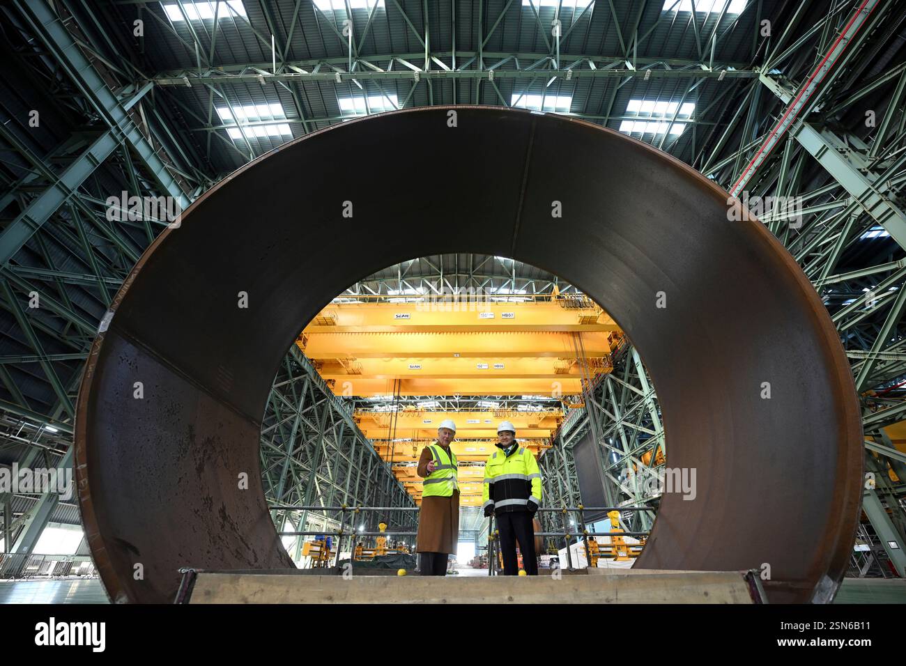 Britain's King Charles III, left, and SeAH President Joosung Lee stand ...