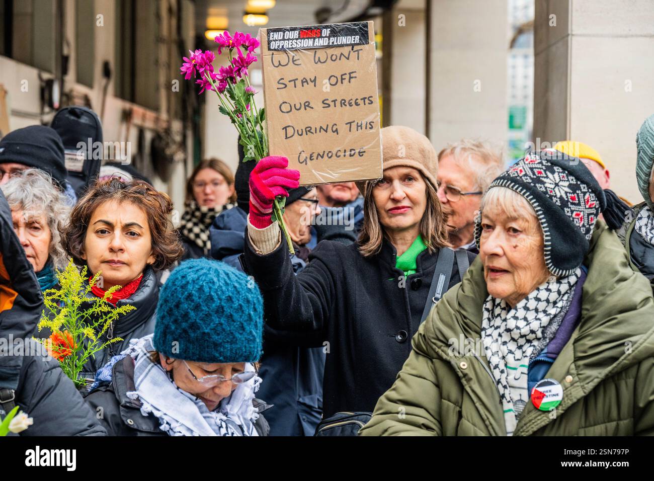 London, UK. 13 Feb 2025. People bring flowers, as they did to the march ...