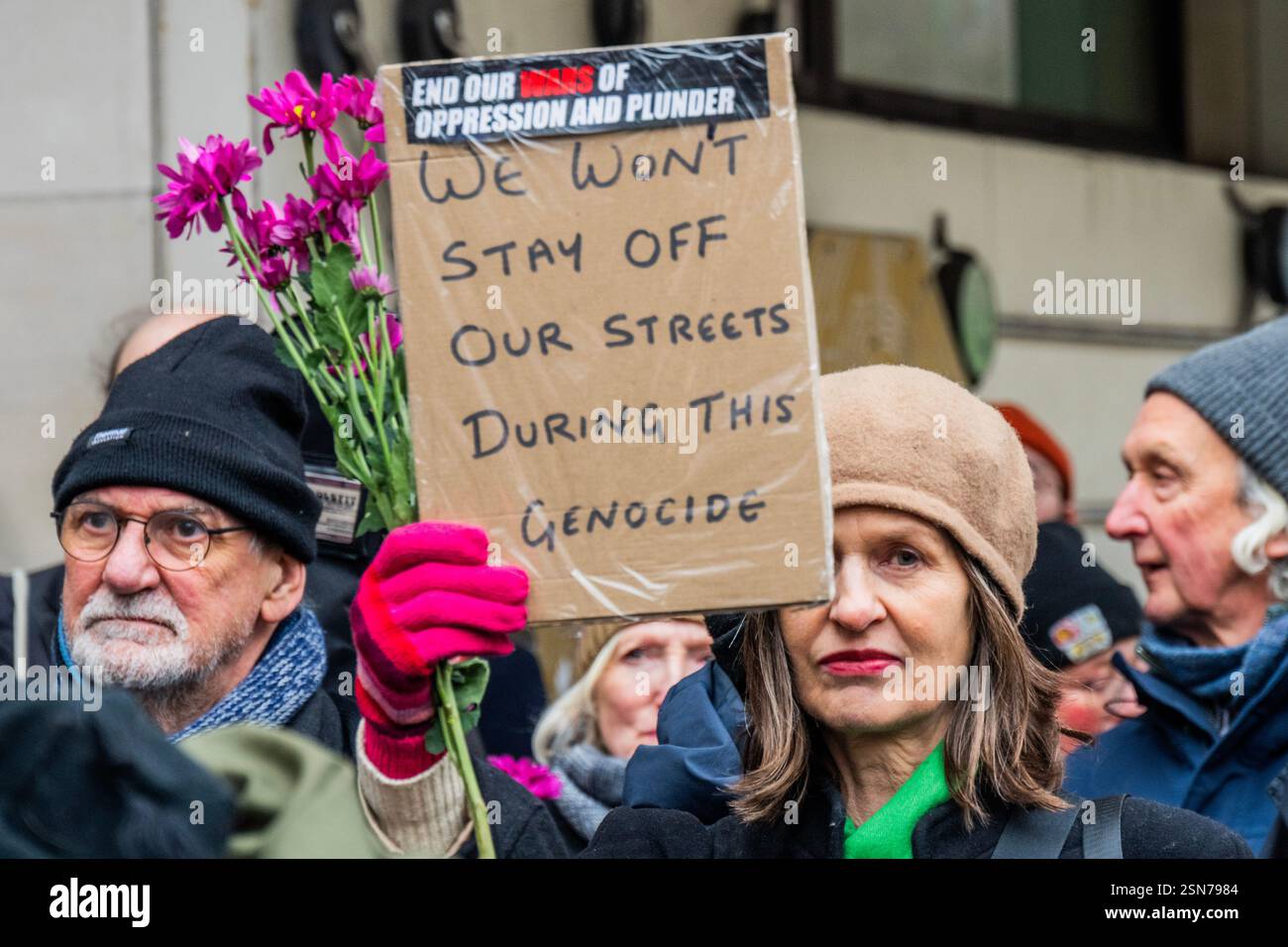 London, UK. 13 Feb 2025. People bring flowers, as they did to the march ...