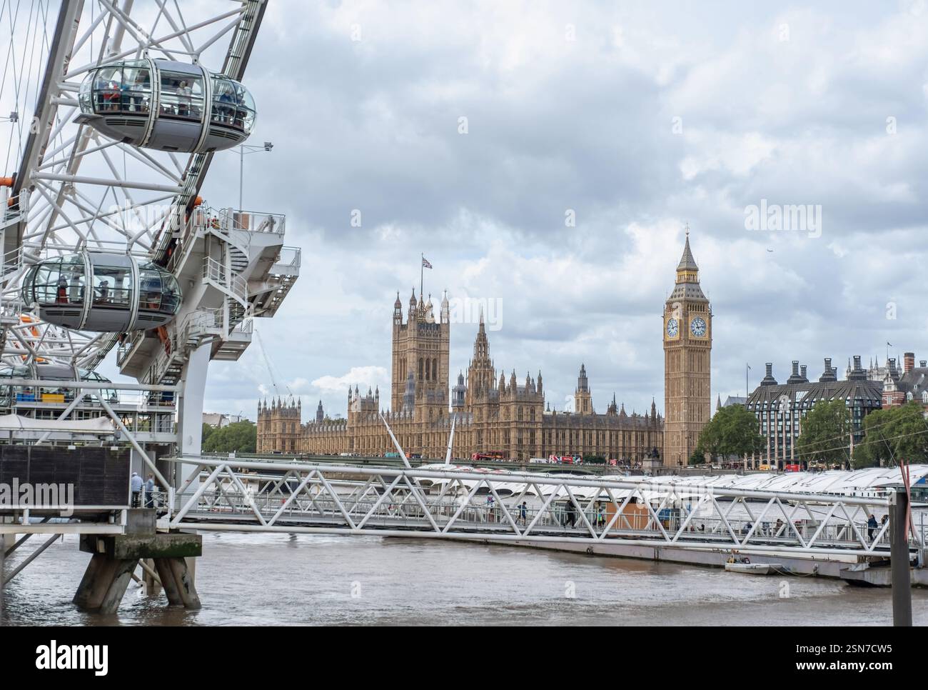 London cityscape features the clock tower and observation wheel ...