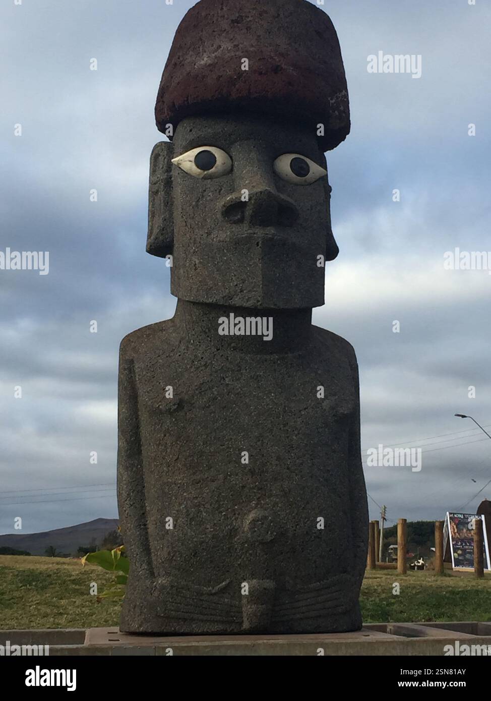 A remarkable moai statue, carved from volcanic rock, towers over the ...