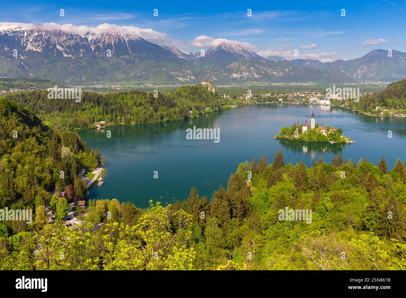 View of lake Bled at in spring with the small island and Assumption of ...