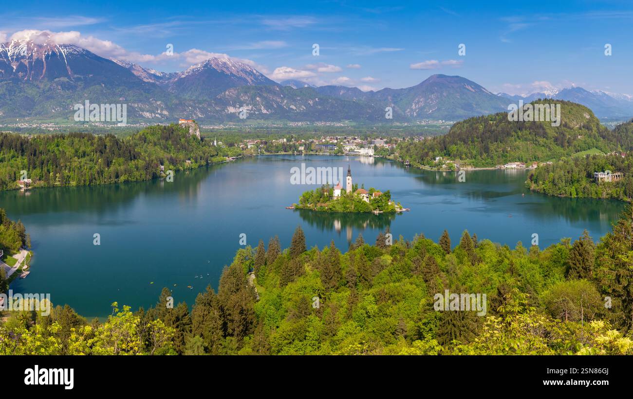 View of lake Bled at in spring with the small island and Assumption of ...