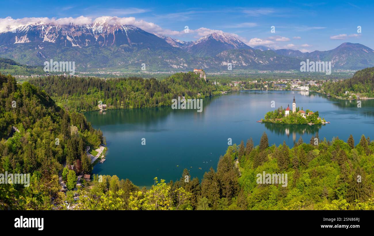 View of lake Bled at in spring with the small island and Assumption of ...