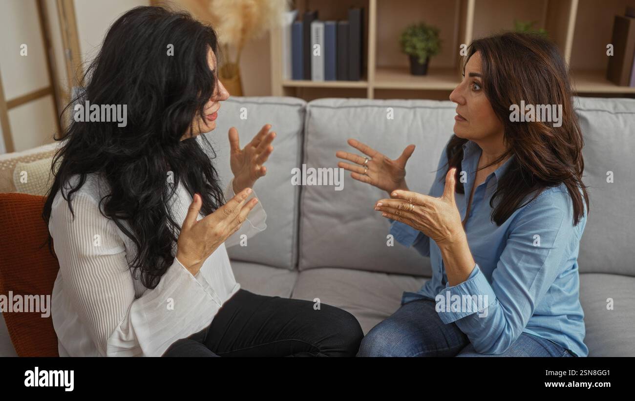 Two women having a heartfelt conversation in a cozy living room ...