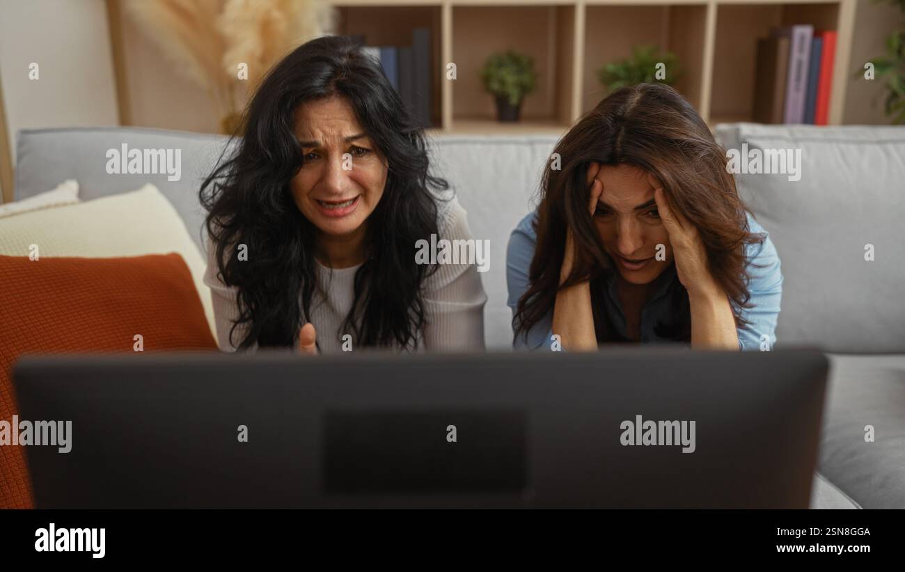 Women watching tv with emotional reactions in a cozy living room ...