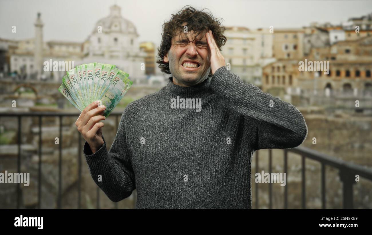 Hispanic man holding russian roubles in front of roman ruins ...
