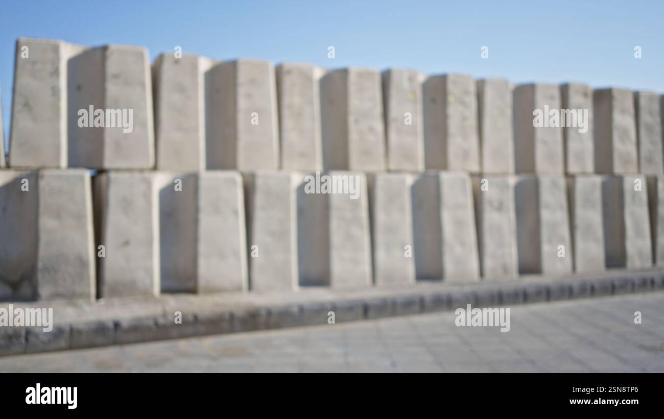 Blurred concrete blocks outdoors in a sunny open space with a clear ...