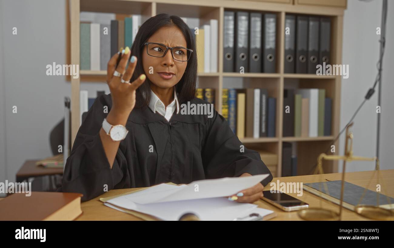 Female judge behind desk holding hi-res stock photography and images ...