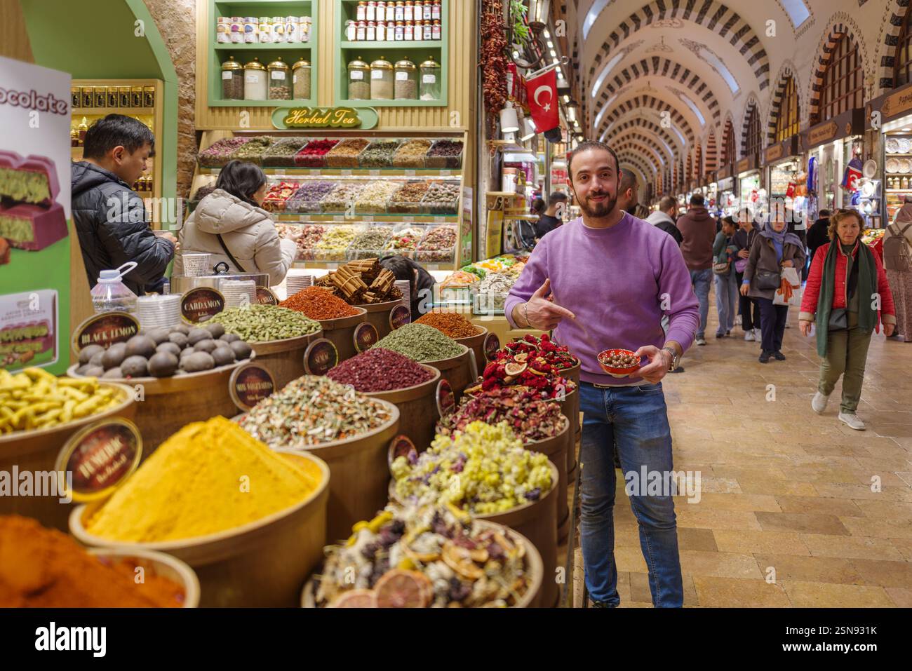 Man selling spices at a spice market stall in the Grand Bazaar in ...
