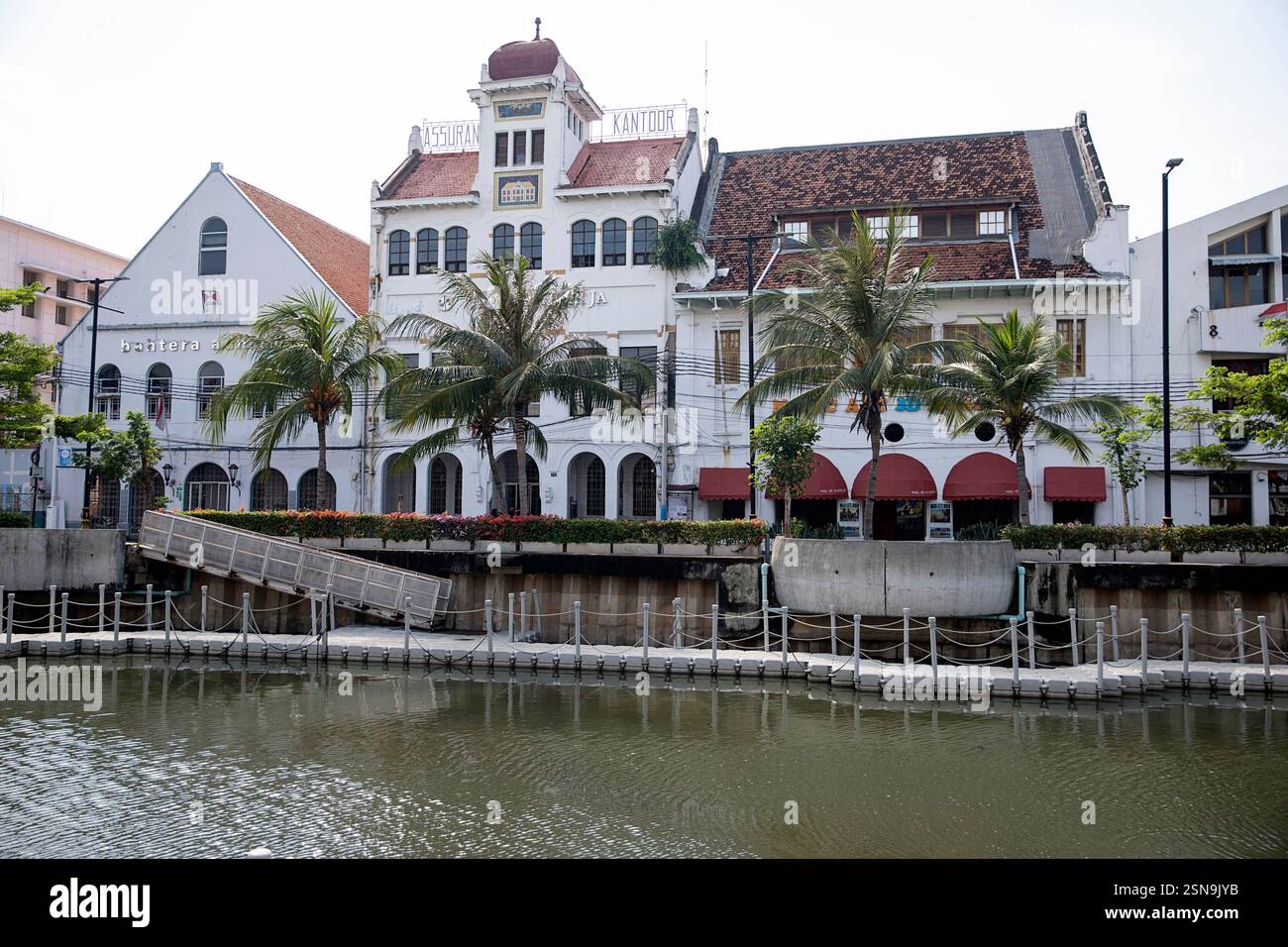 Old dutch colonial building in the old town of Jakarta across the river ...
