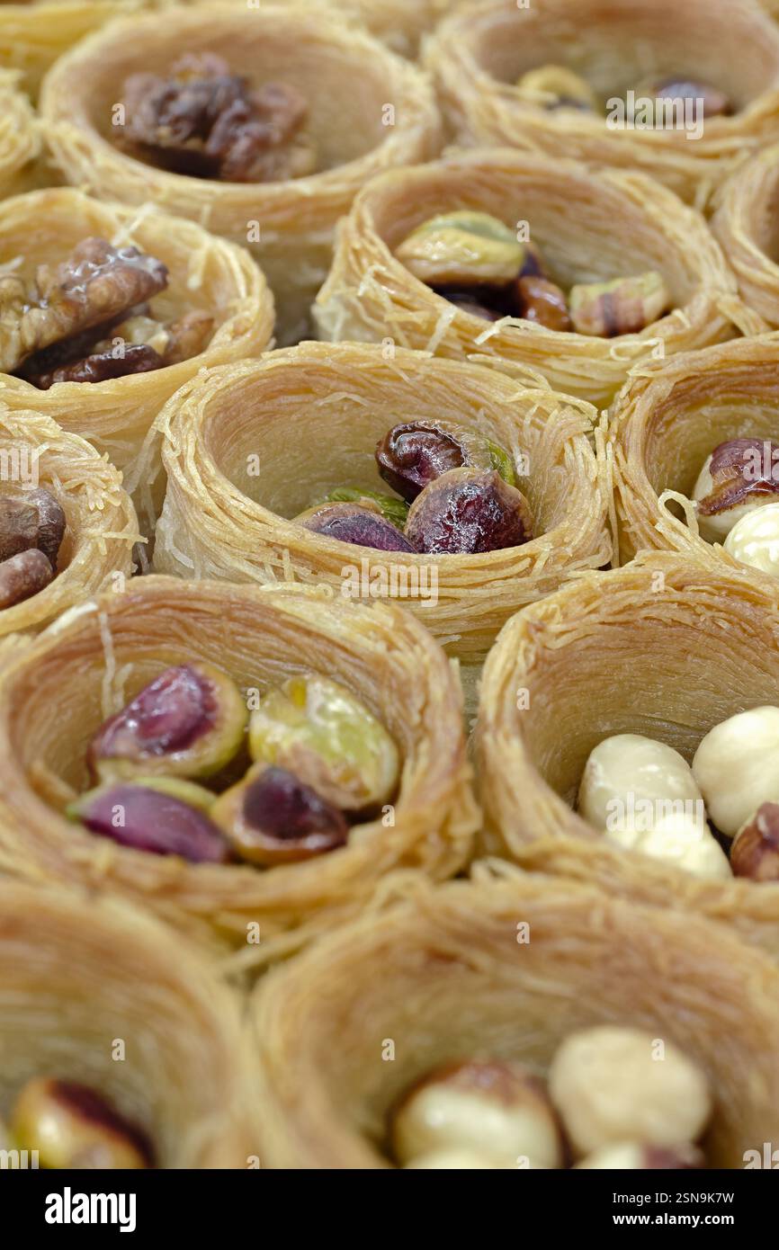 Baklava, a traditional Turkish dessert made from puff pastry filled ...