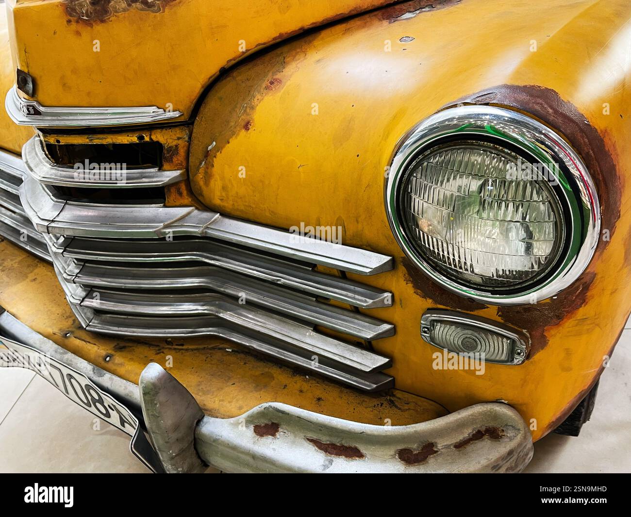 Lviv, Ukraine - February 12, 2025: Close-up of yellow classic GAZ-M20 ...