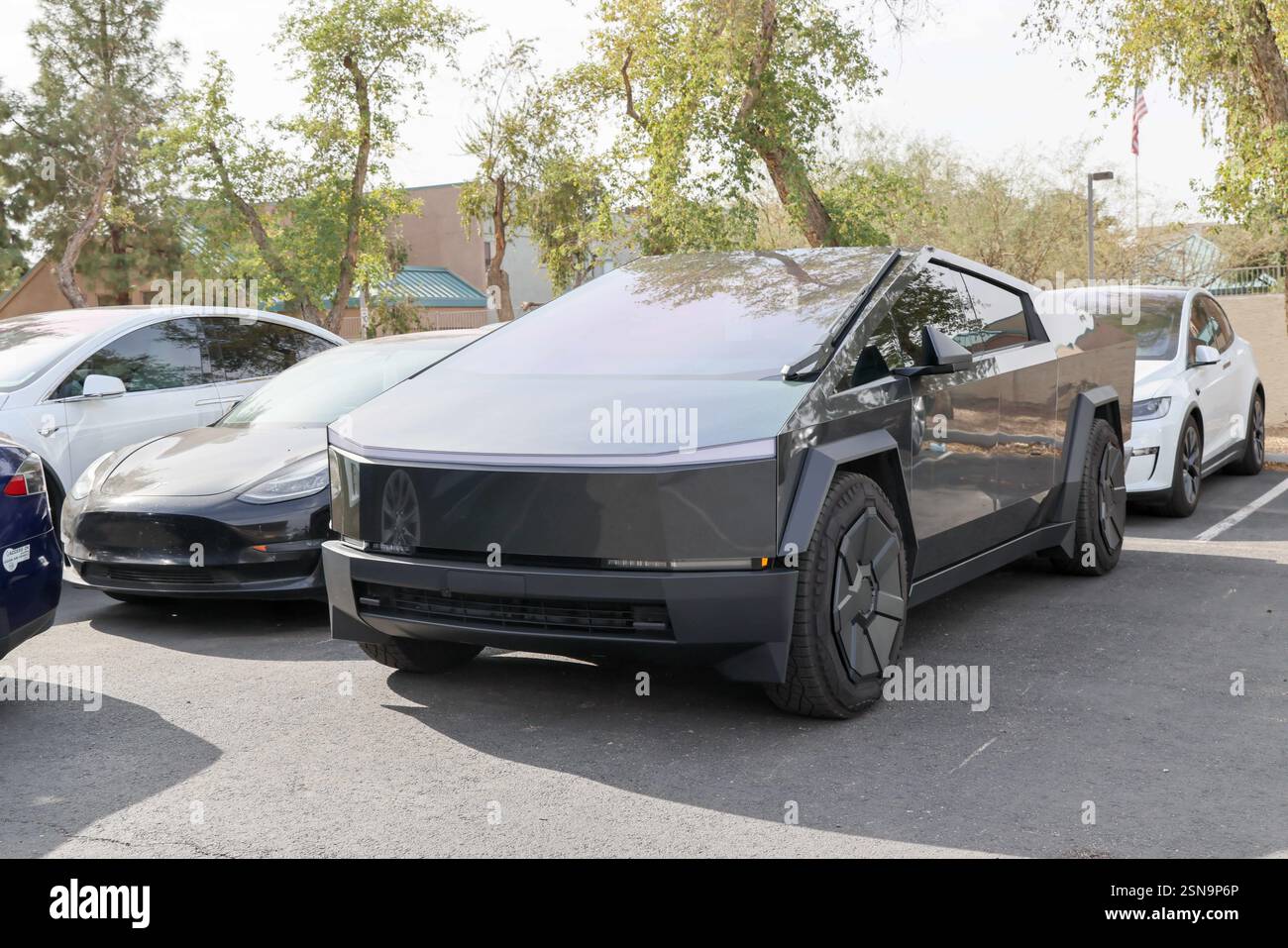 Telsa EV cars and a Cybertruck are parked at a Tesla Service Station on ...