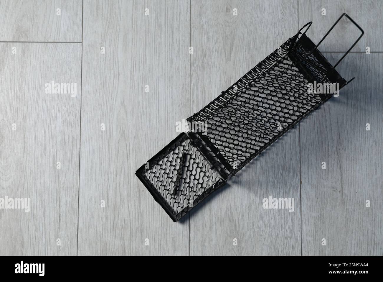 One metal mouse trap on floor, top view. Space for text Stock Photo - Alamy