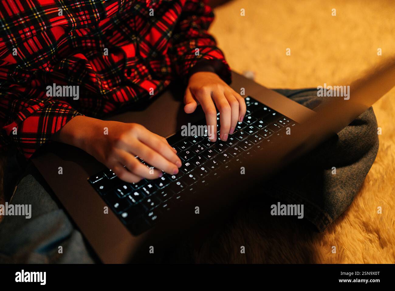 Top view of unrecognizable child girl wearing red and black checkered ...