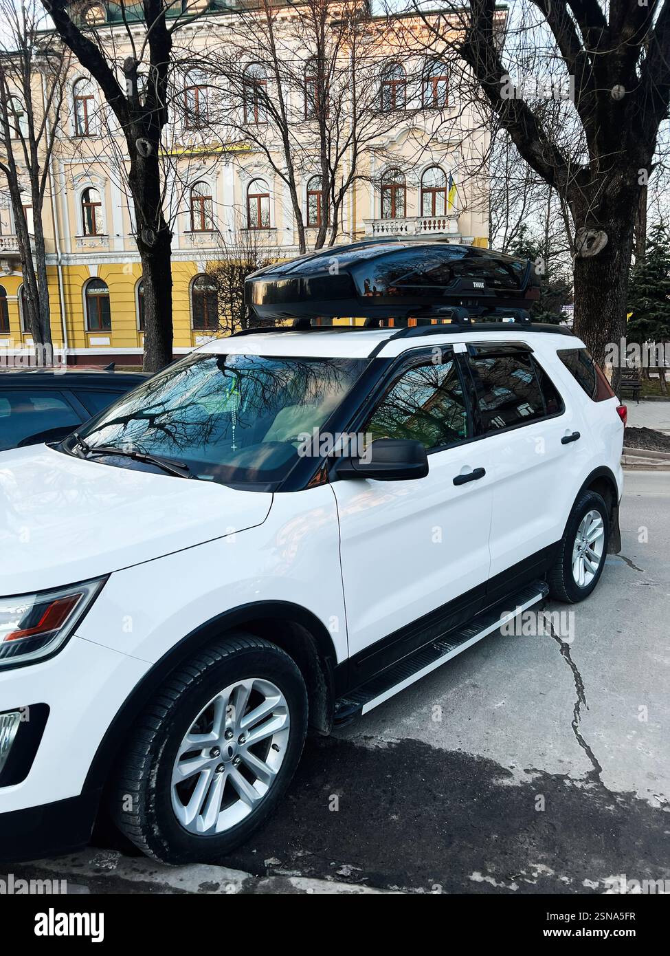 Lviv, Ukraine - February 12, 2025: A white Ford Explorer SUV with Thule ...