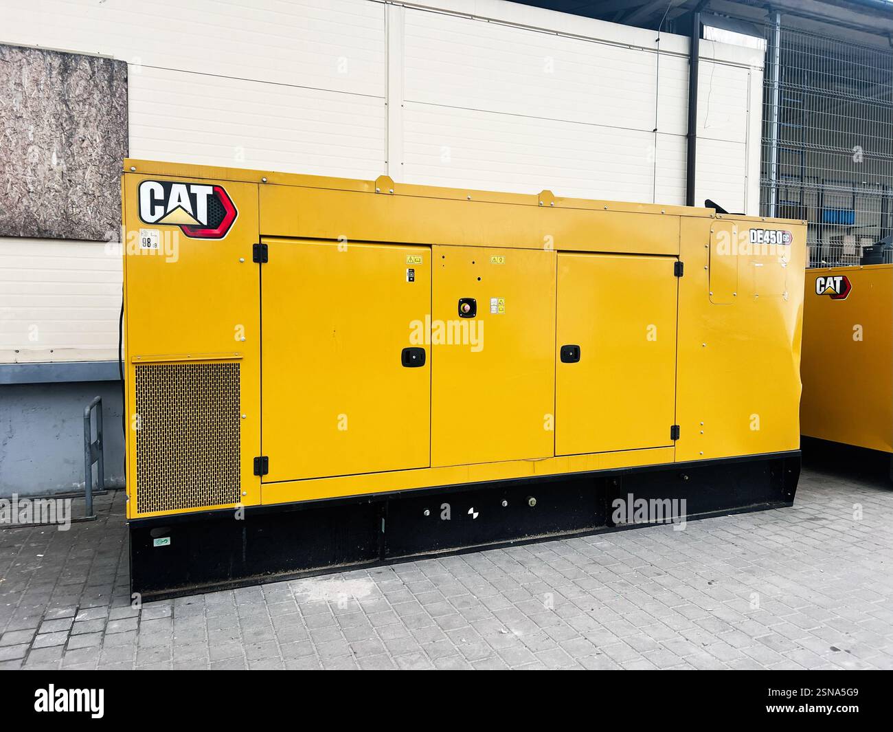 Lviv, Ukraine - February 12, 2025: Large yellow CAT DE450 GC generator ...