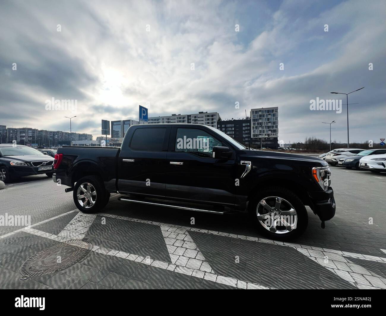 Lviv, Ukraine - February 12, 2025: A sleek black Ford F 150 XLT pickup ...