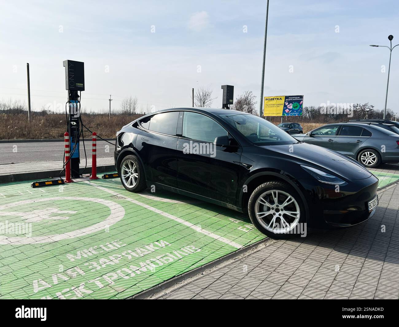 Lviv, Ukraine - February 12, 2025: A black electric Tesla Model Y car ...