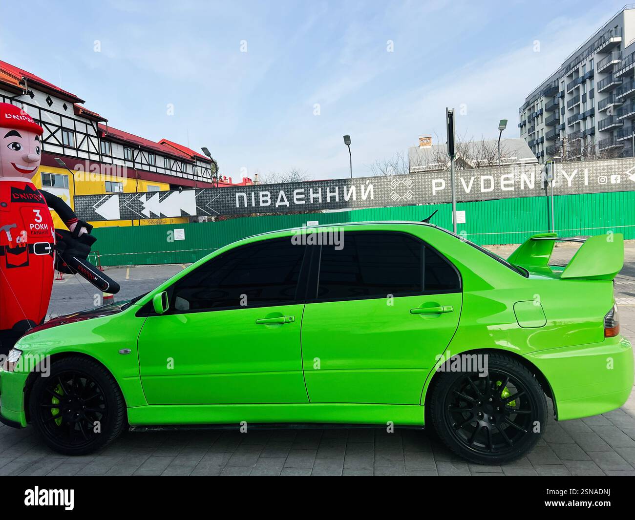 Lviv, Ukraine - February 12, 2025: A vivid green Mitsubishi Lancer ...