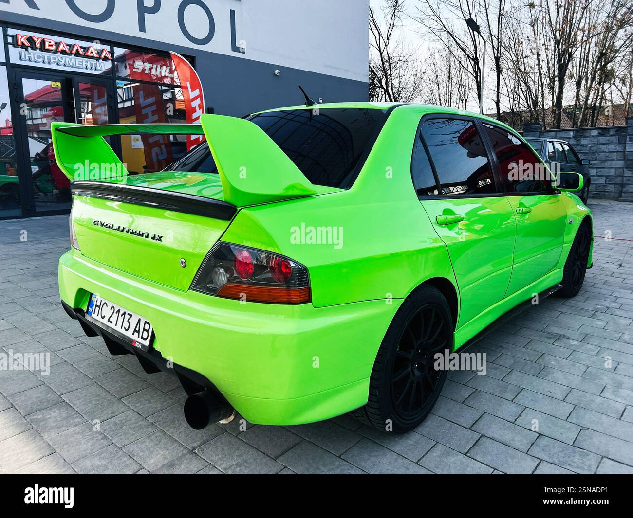 Lviv, Ukraine - February 12, 2025: Compact and vibrant green Mitsubishi ...