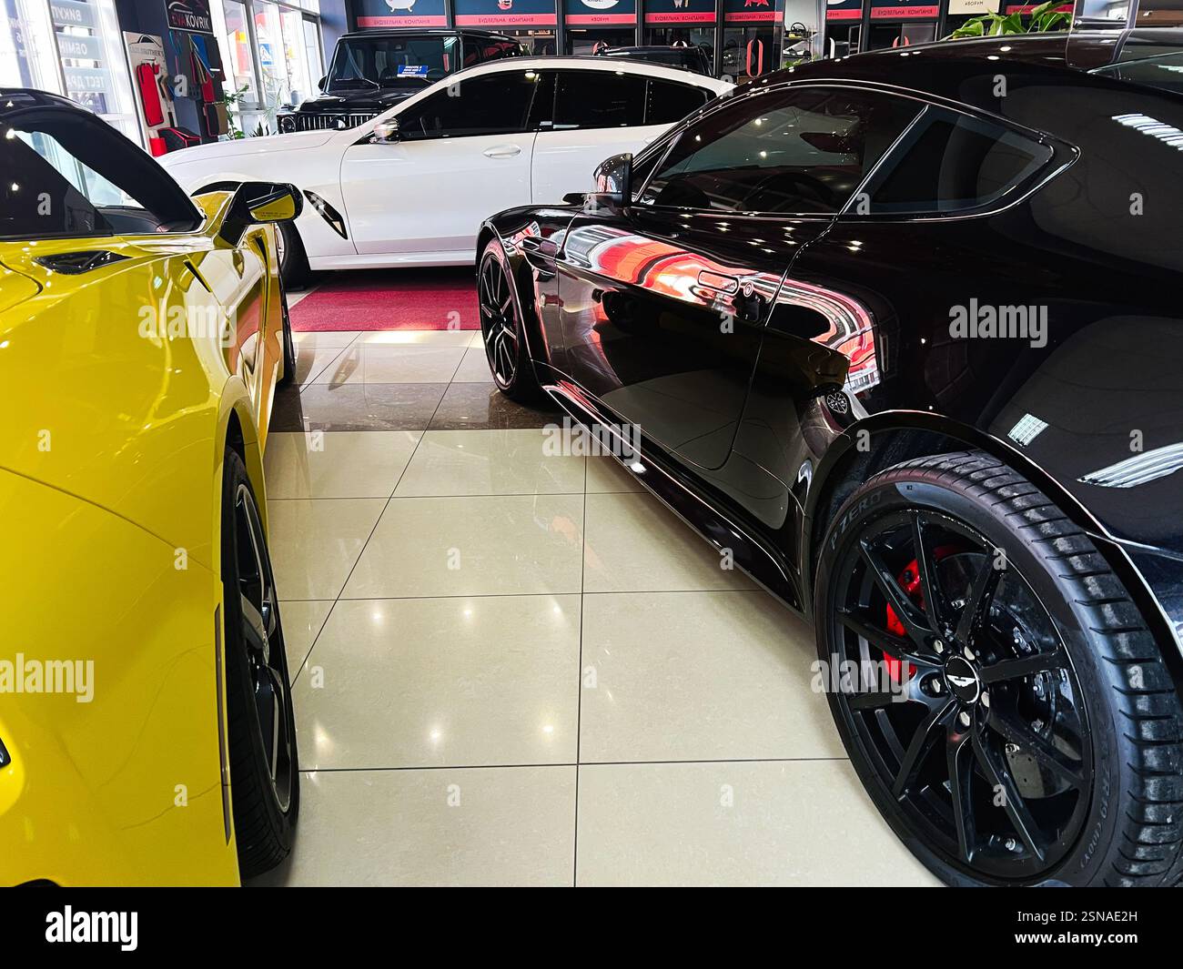 Lviv, Ukraine - February 12, 2025: Stylish luxury cars showcased in a ...