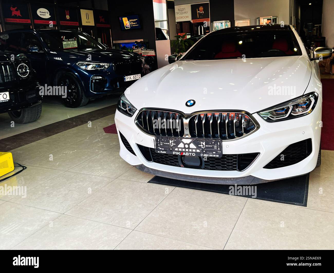 Lviv, Ukraine - February 12, 2025: Elegant white BMW M850 car showcased ...