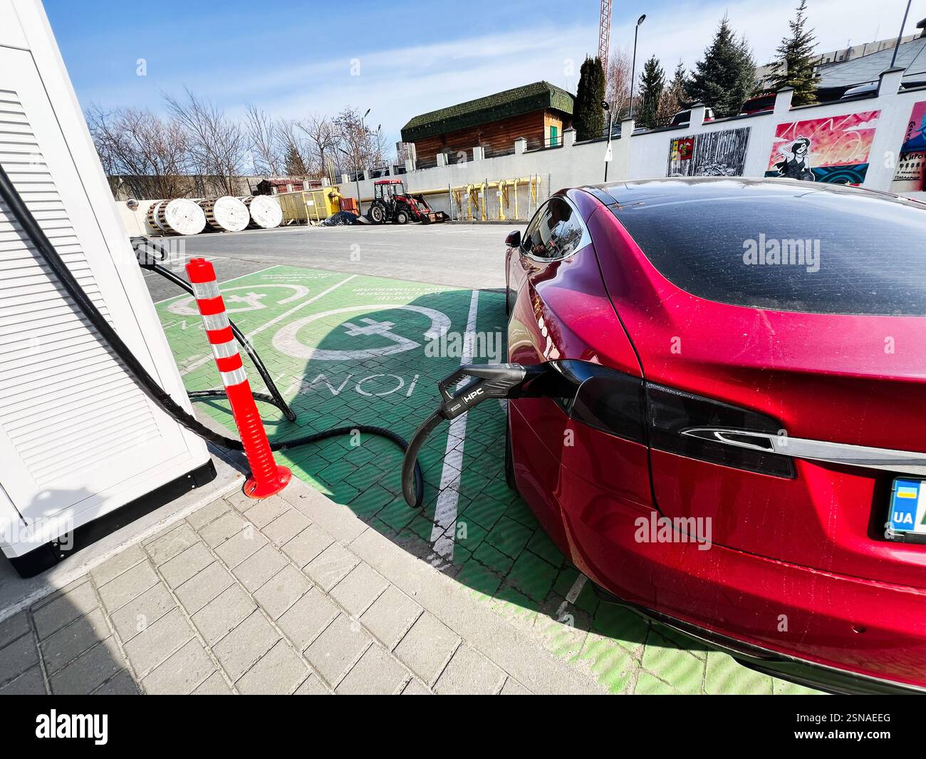 Lviv, Ukraine - February 12, 2025: Red electric Tesla Model S car ...