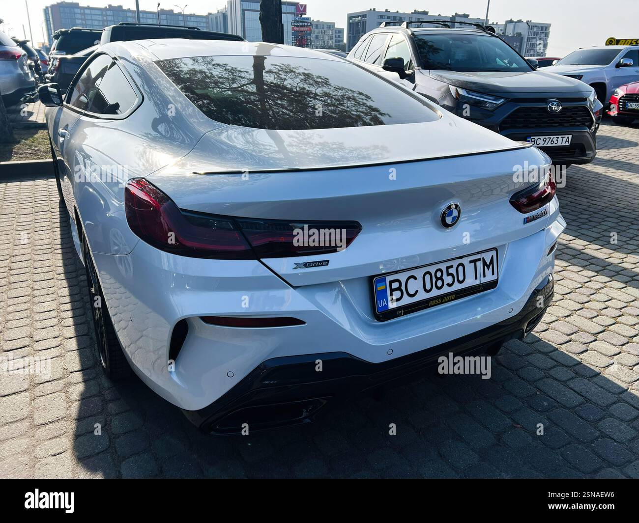 Lviv, Ukraine - February 12, 2025: White sporty luxury BMW M850i car with modern design in ...